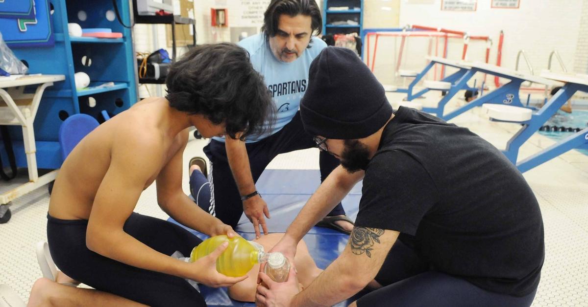 Queens swim coach saves drowning student